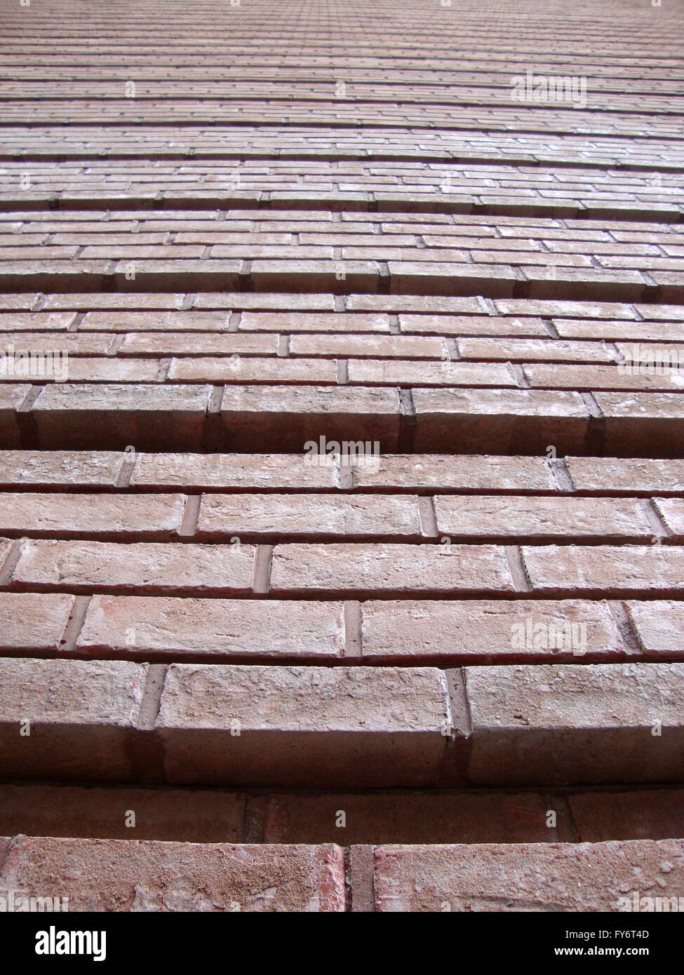 Red Brick Wall with grooves going upward making a pattern Stock Photo ...