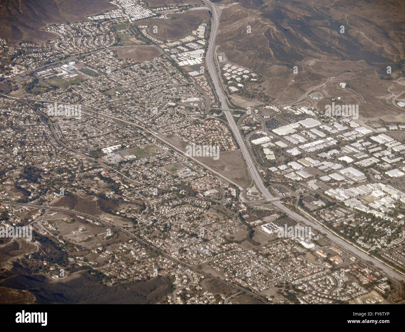 Highway stretches through LA Suburbs and Mountains with roads exited ...