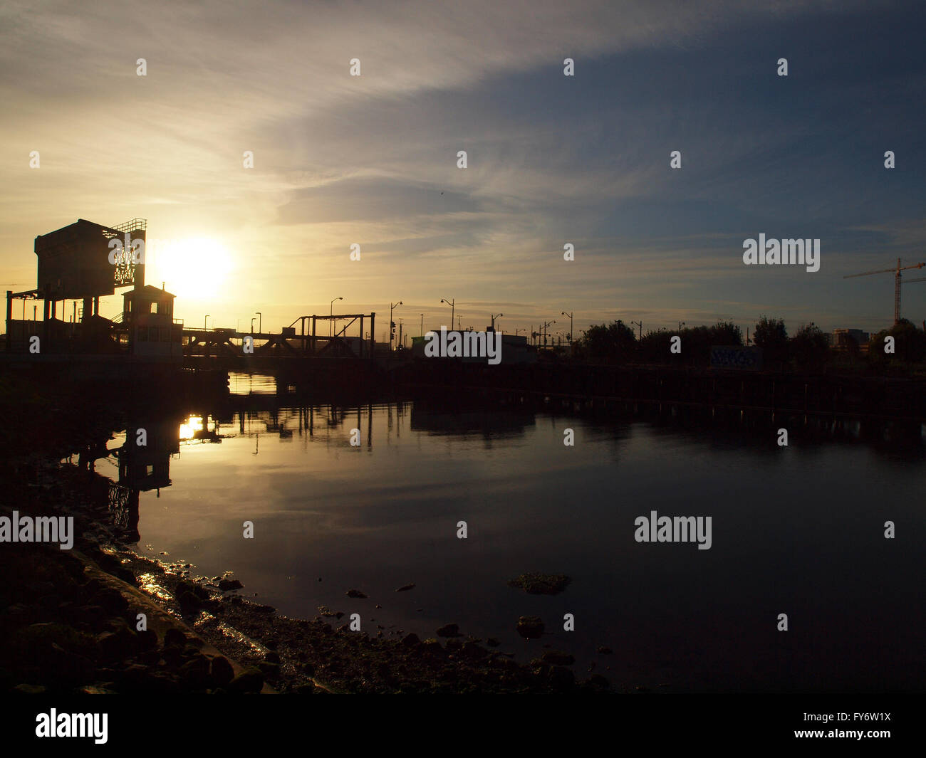 Sunrises over Mission Creek and the 4th street bridge with construction ...