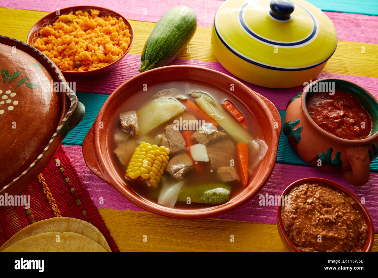 Caldo de res Mexican beef broth in table with sauces Stock Photo - Alamy