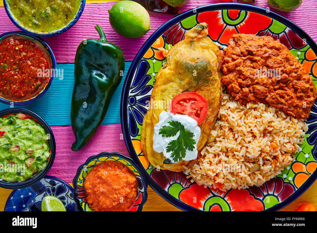 Chili relleno chili pepper poblano filled with cheese in dish with with ...