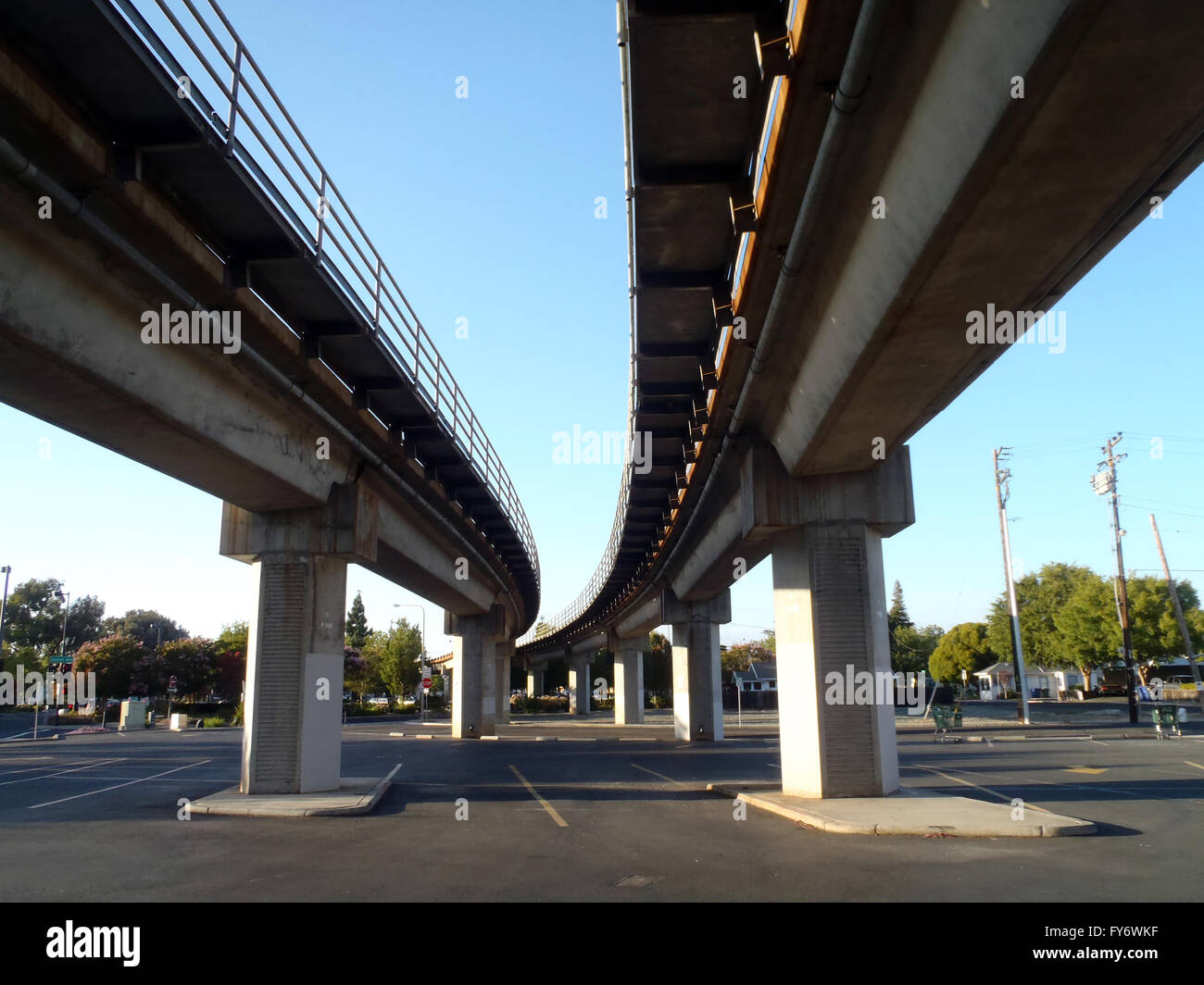 Parking lot under a Public Transit overhead rail-line in California ...