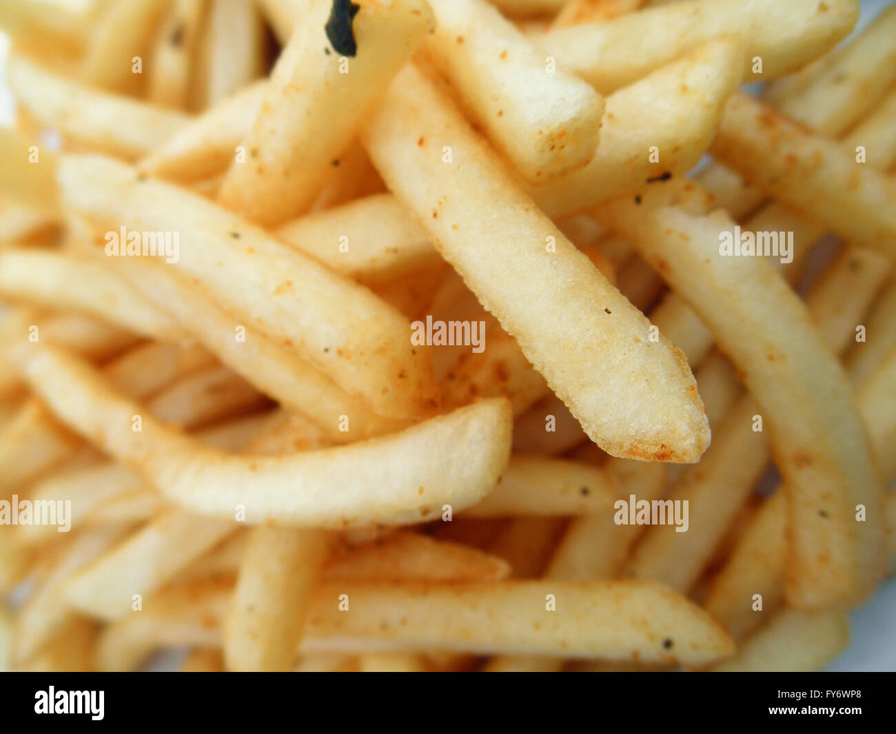 Close up of American Fast food style straight fresh french fries light ...