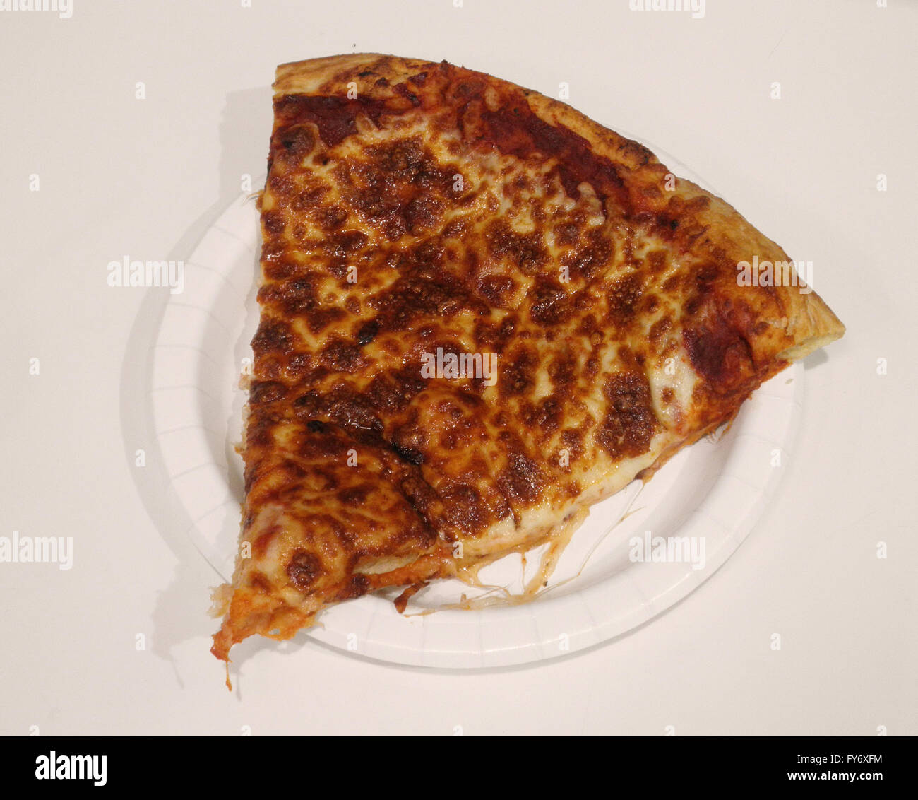 close up of Greasy Pizza plain Cheese on a paper plate sitting on a ...