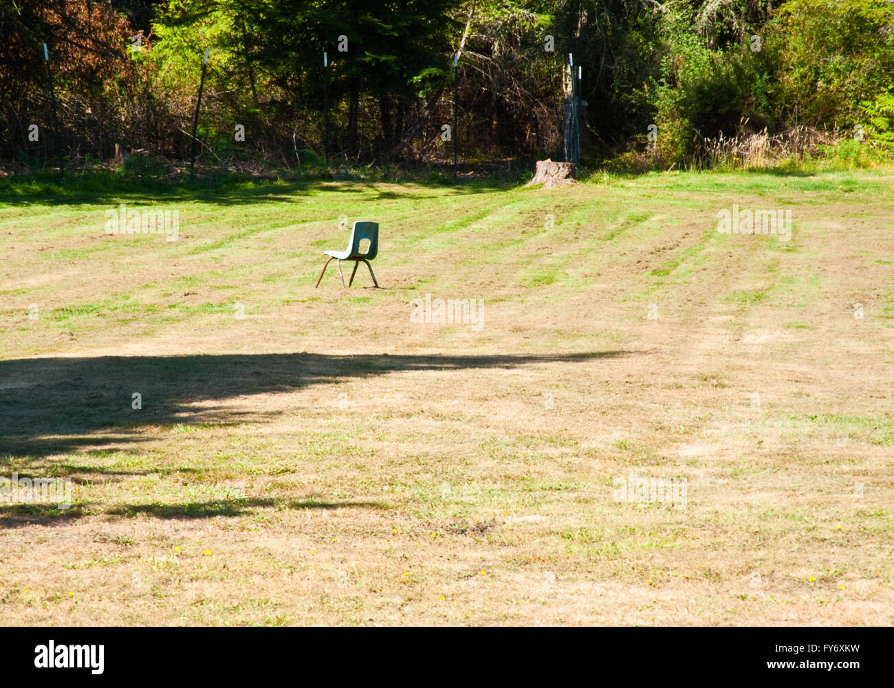 Empty child’s chair in a field Stock Photo - Alamy