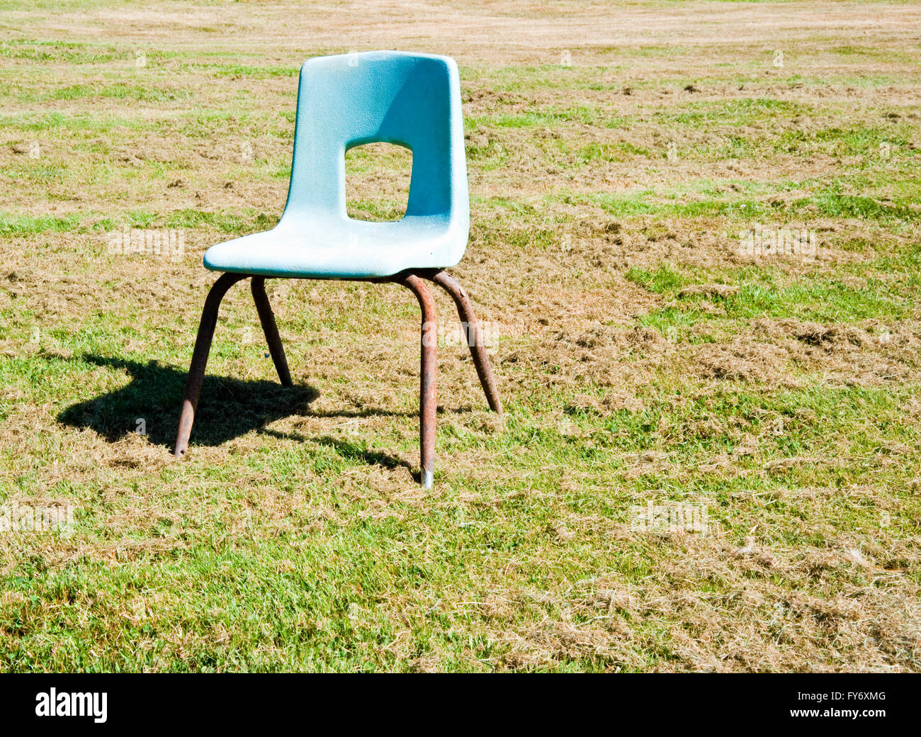 Empty child’s chair in a field Stock Photo - Alamy