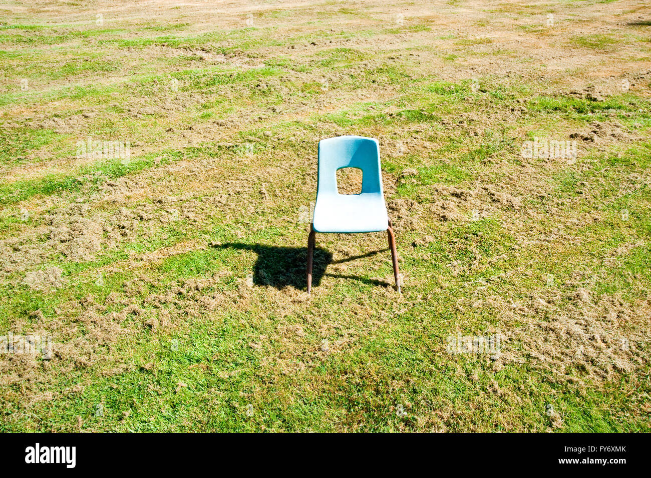 Empty child’s chair in a field Stock Photo - Alamy