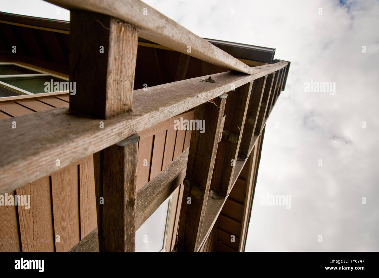 Ladder leaning against a house Stock Photo - Alamy