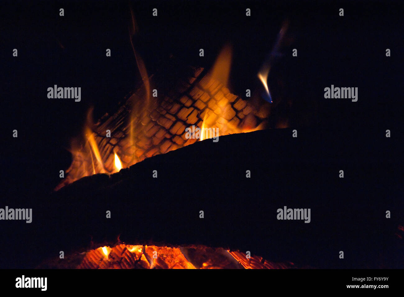 Blazing fire in a wood burning stove Stock Photo - Alamy