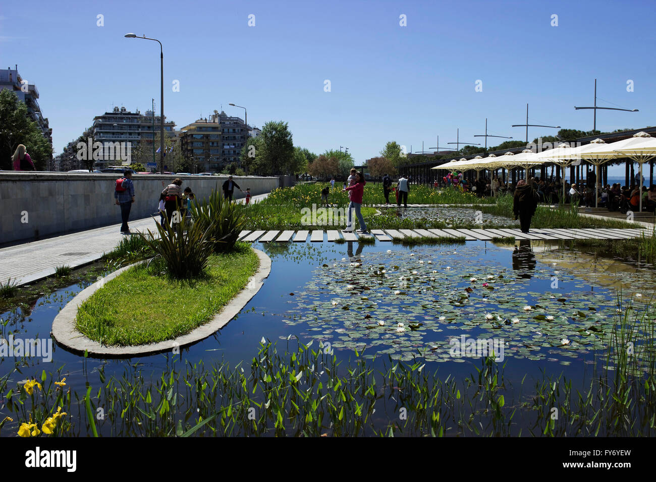 People walking around the Garden of Water theme park aquatic elements ...