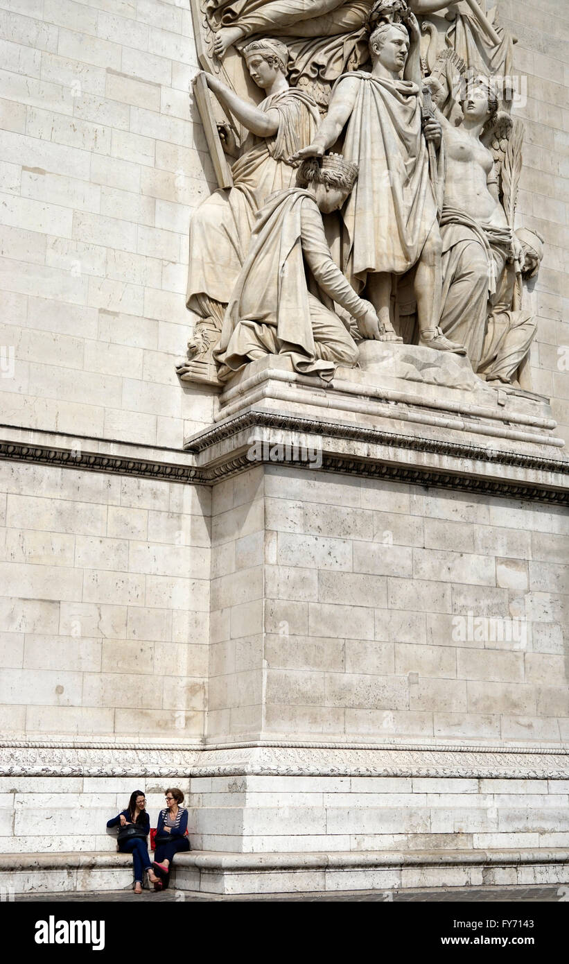 Visitors resting under the sculptures of Le Triomphe de 1810 on the ...
