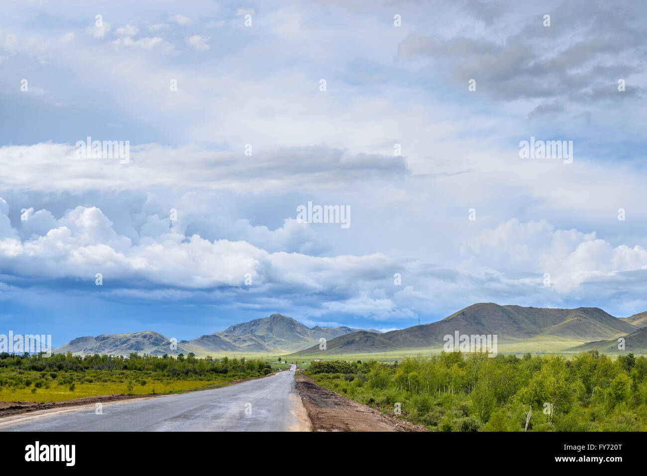 hazy sky landscape with road Stock Photo - Alamy