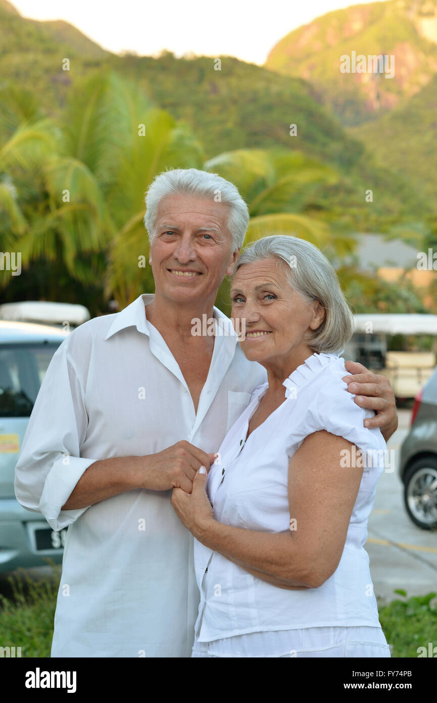 elderly couple rest at tropical resort Stock Photo - Alamy