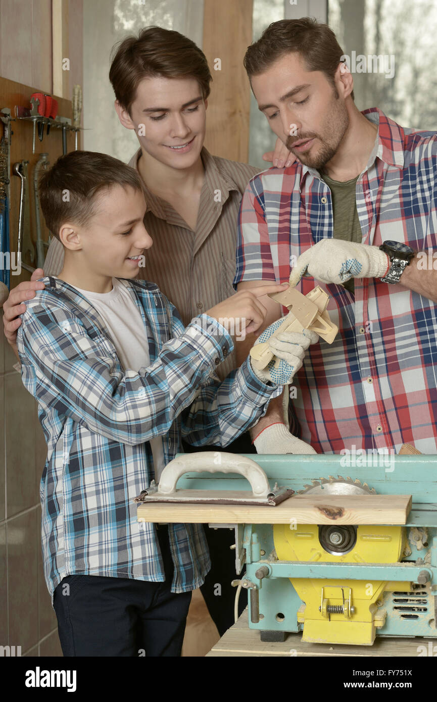 men and boy doing repair at home Stock Photo - Alamy