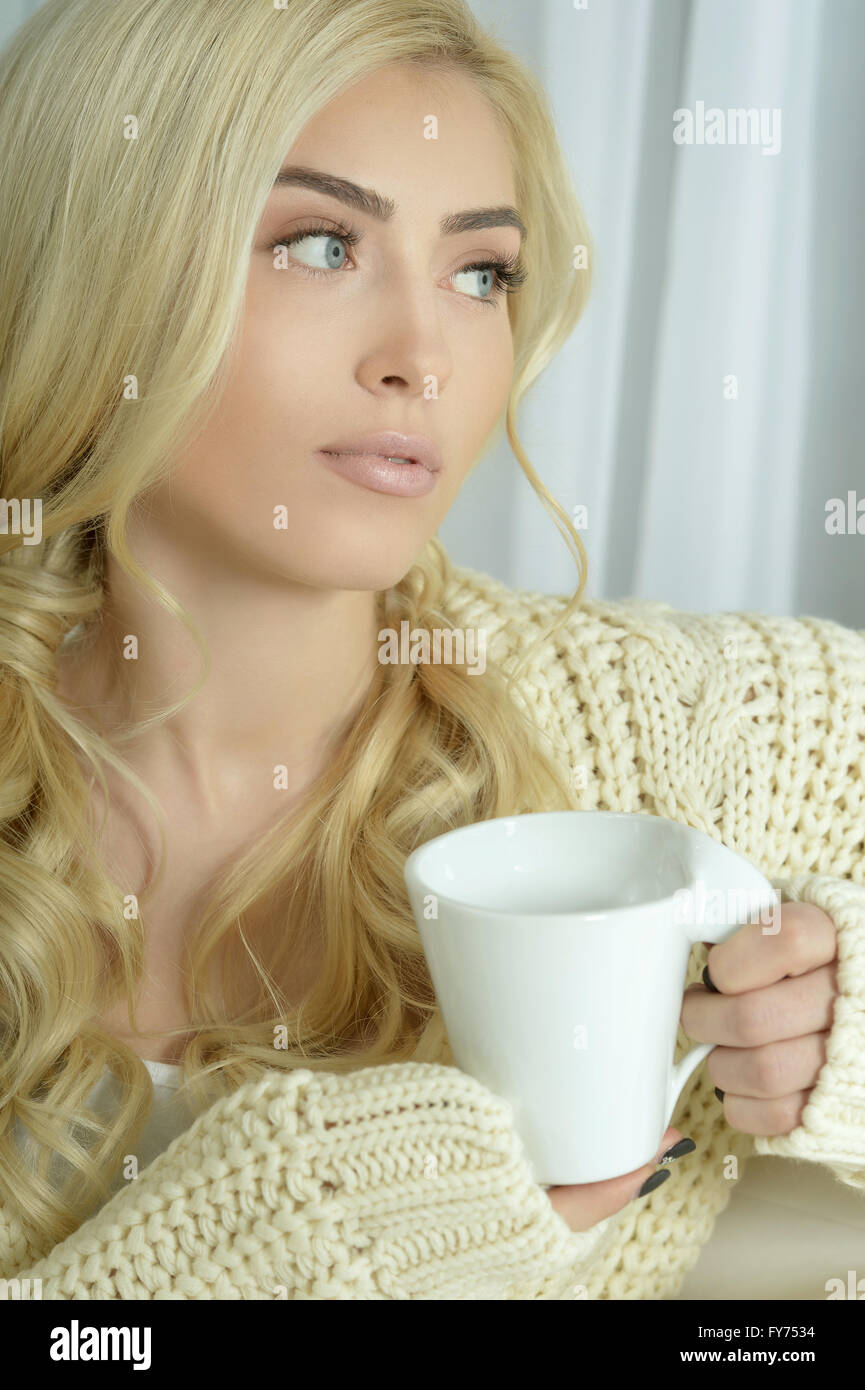 young beautiful woman drinking tea Stock Photo - Alamy