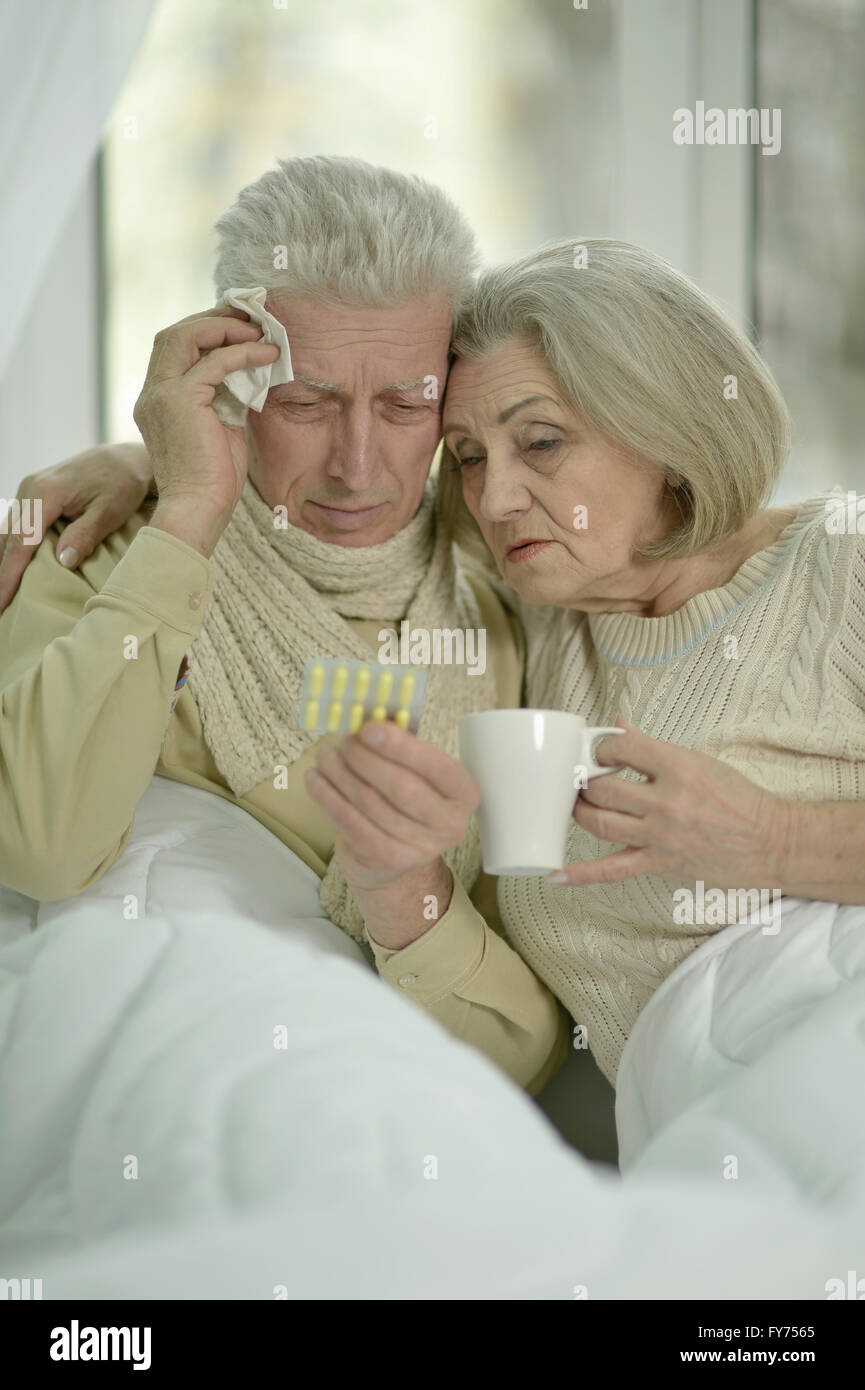 sick elderly couple in bed Stock Photo - Alamy