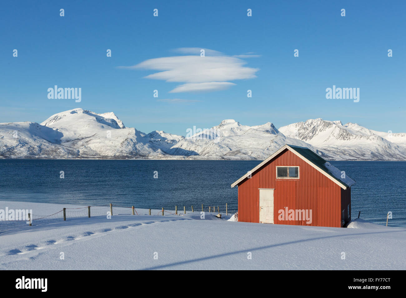 Snow Mountains and Red Cabin by a Fjord in Arctic Norway Stock Photo ...