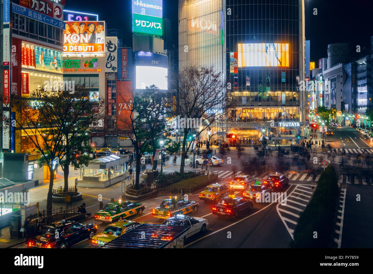 TOKYO, JAPAN - JANUARY 12, 2016: Pedestrians cross at Shibuya Crossing ...