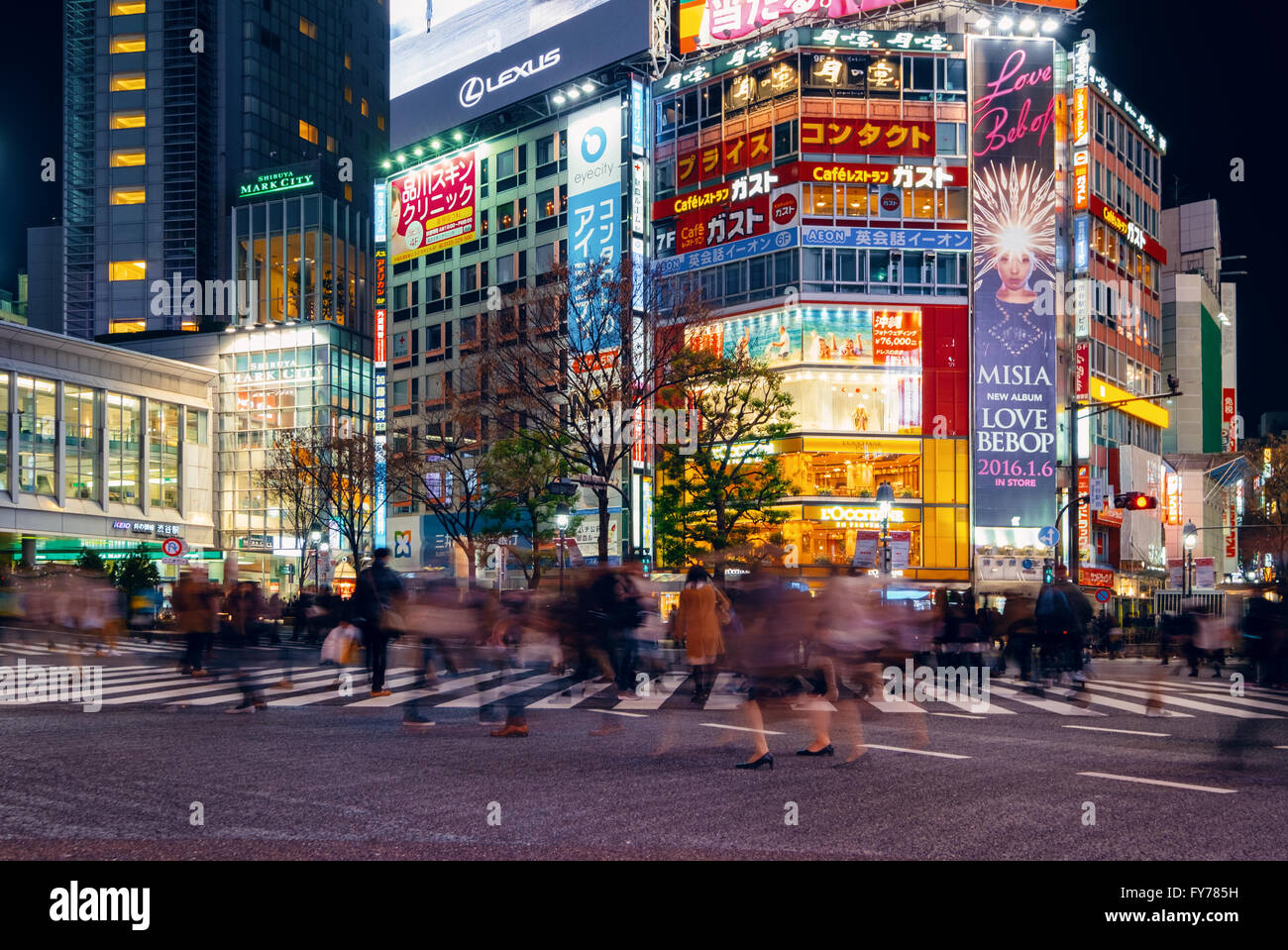 TOKYO, JAPAN - JANUARY 12, 2016: Pedestrians cross at Shibuya Crossing ...