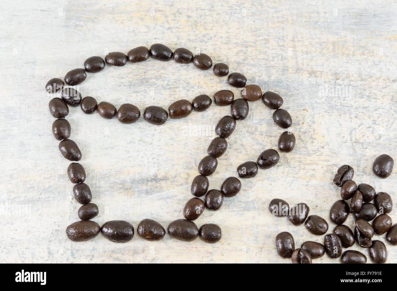 Coffee beans forming a coffee cup Stock Photo - Alamy
