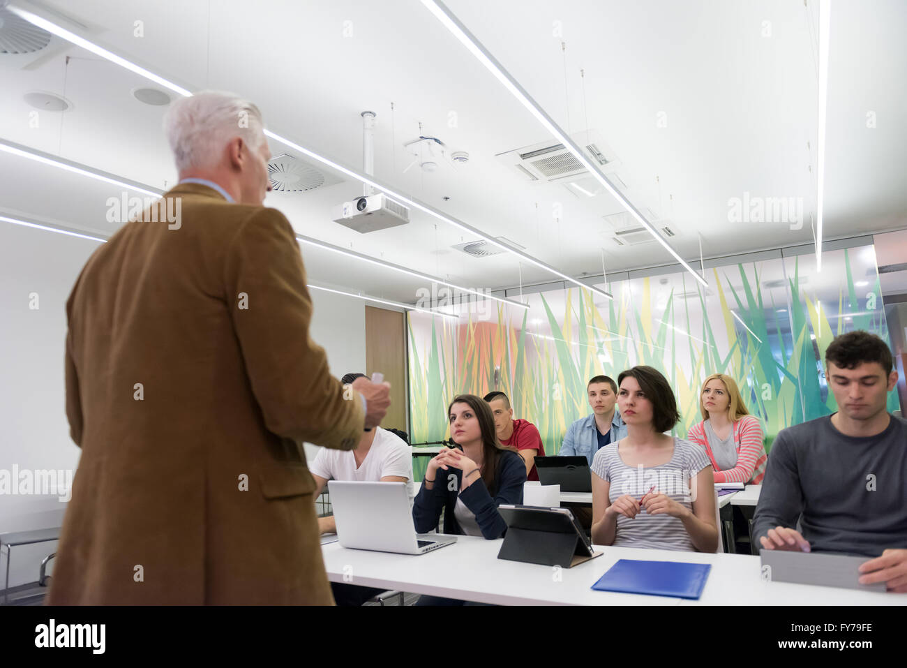 group of students study with professor in modern school classroom Stock ...