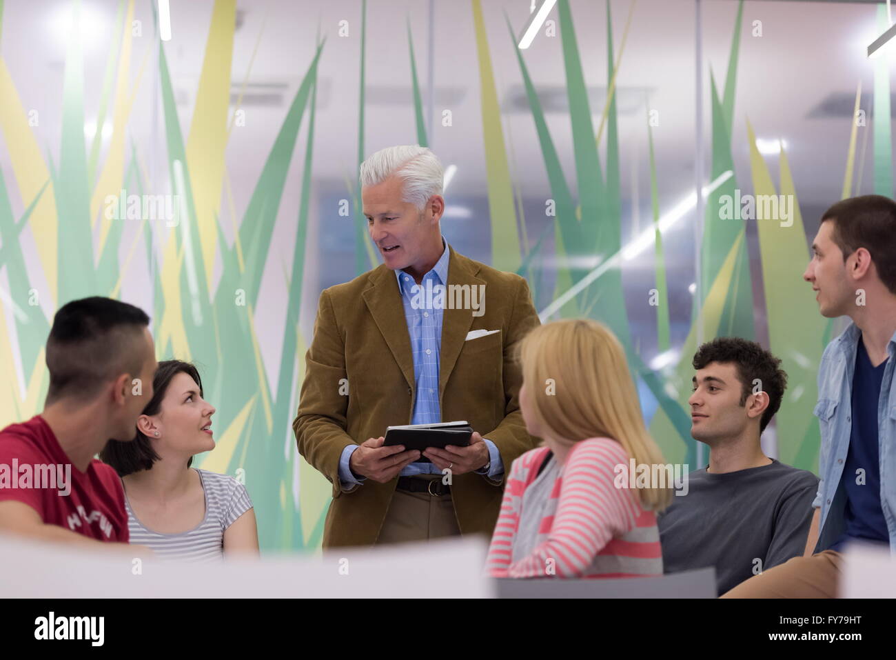 group of students study with professor in modern school classroom Stock ...