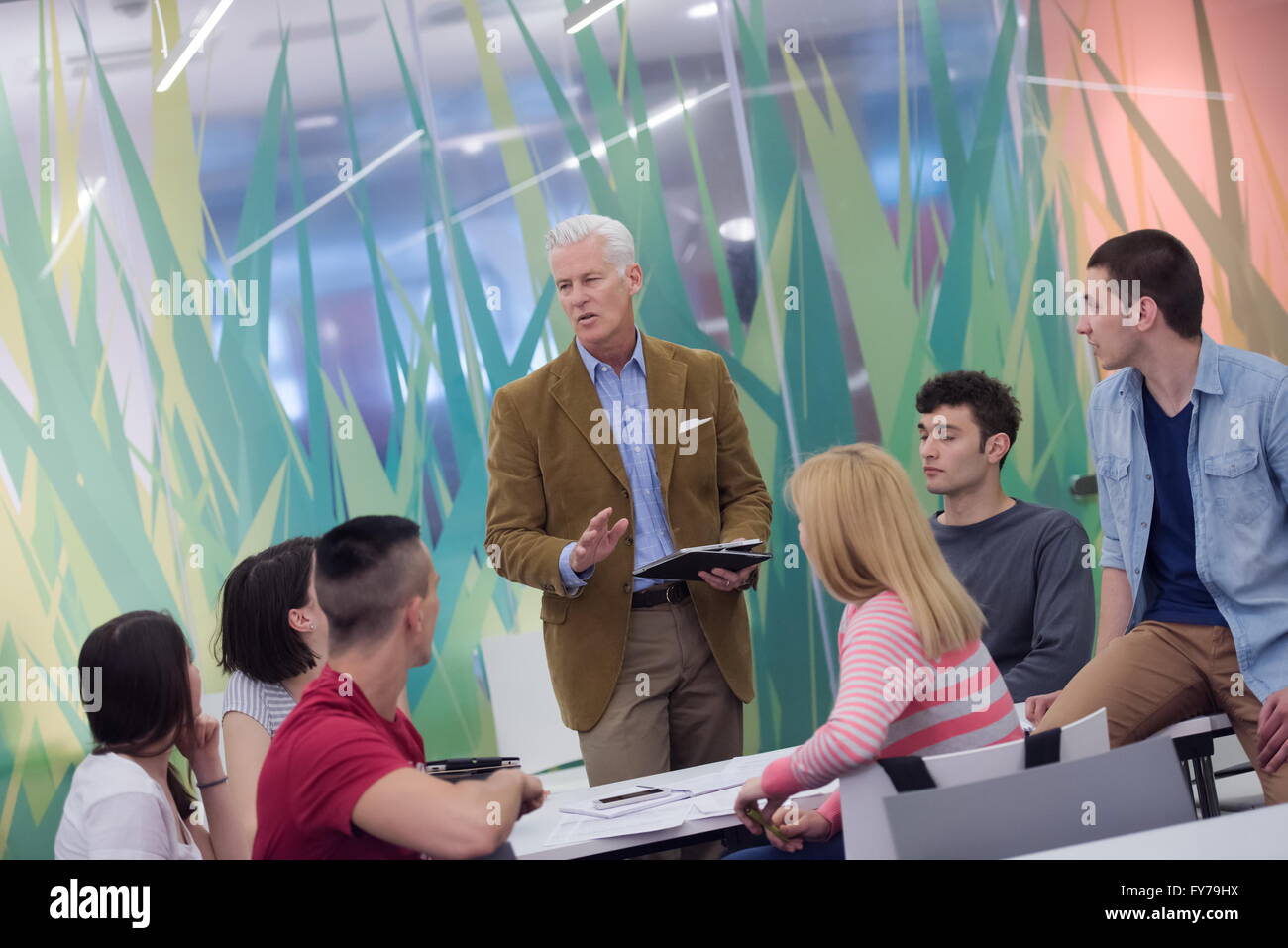 group of students study with professor in modern school classroom Stock ...
