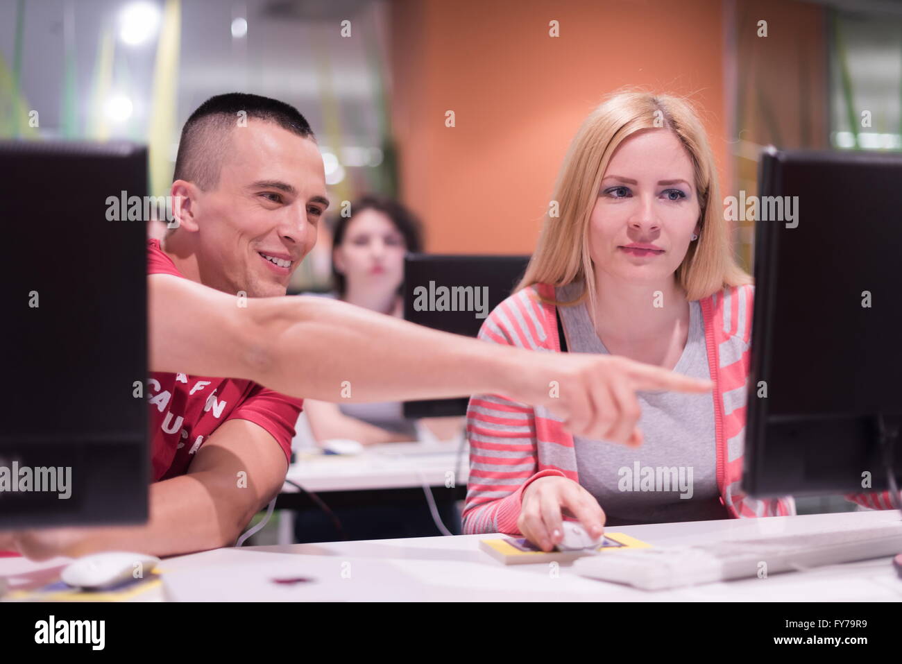 technology students group in computer lab school classroom working on ...