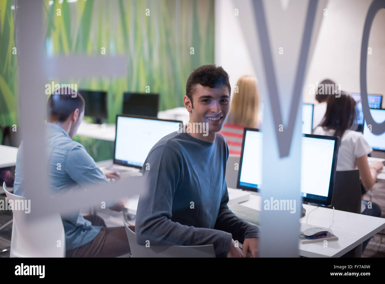 technology students group in computer lab school classroom working on ...