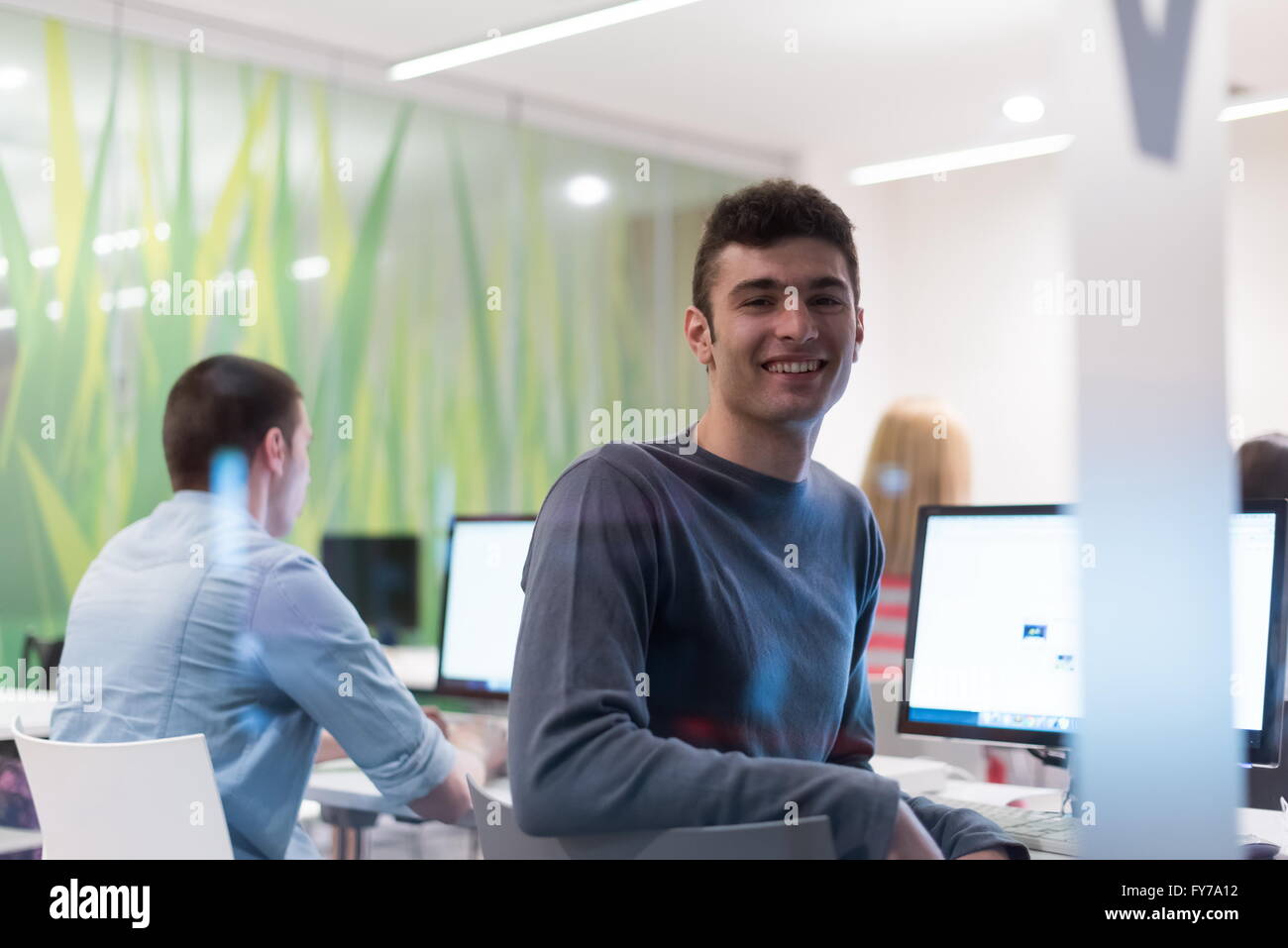 technology students group in computer lab school classroom working on ...