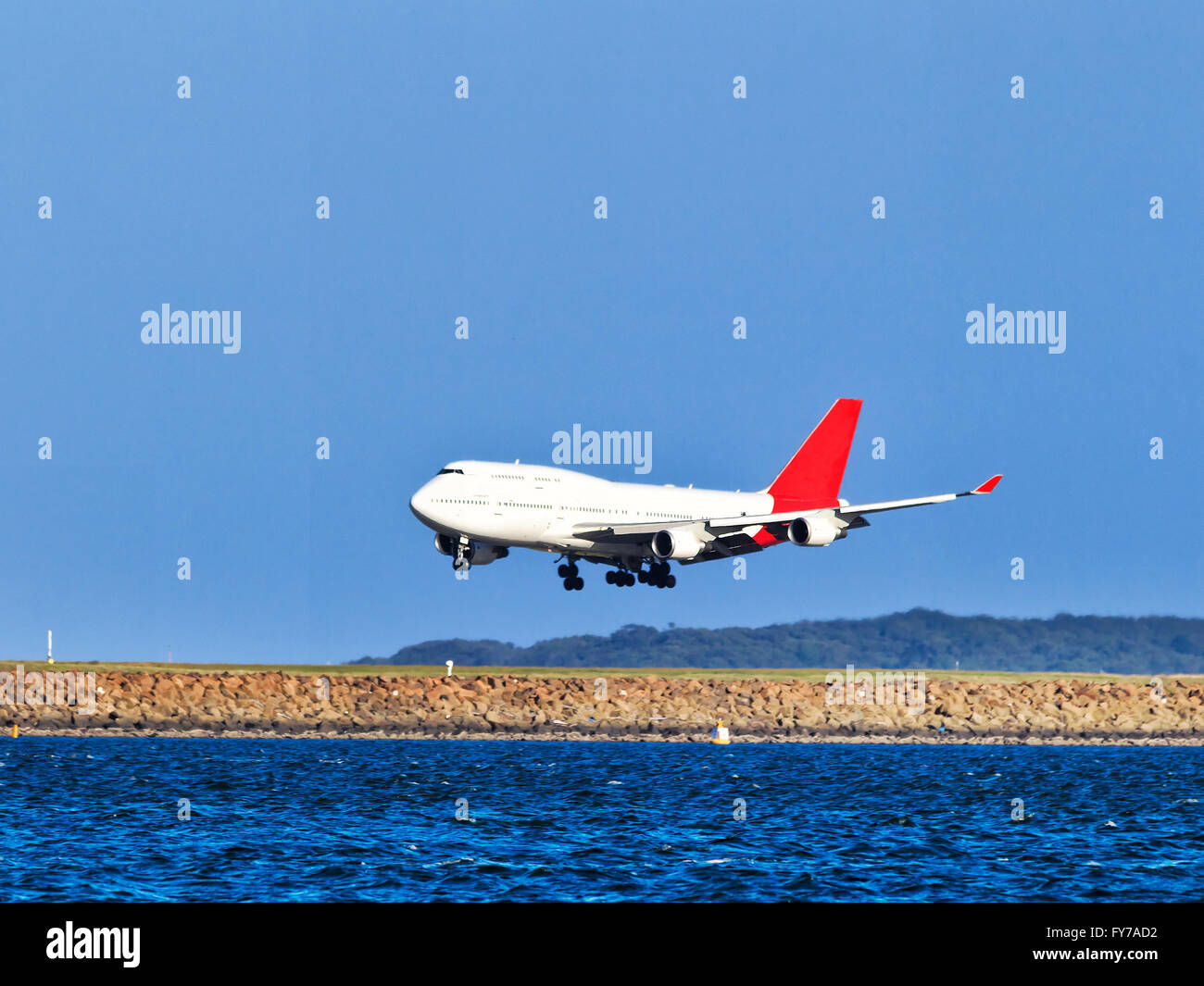 oversized double-deck airplane approaching airport runway during ...