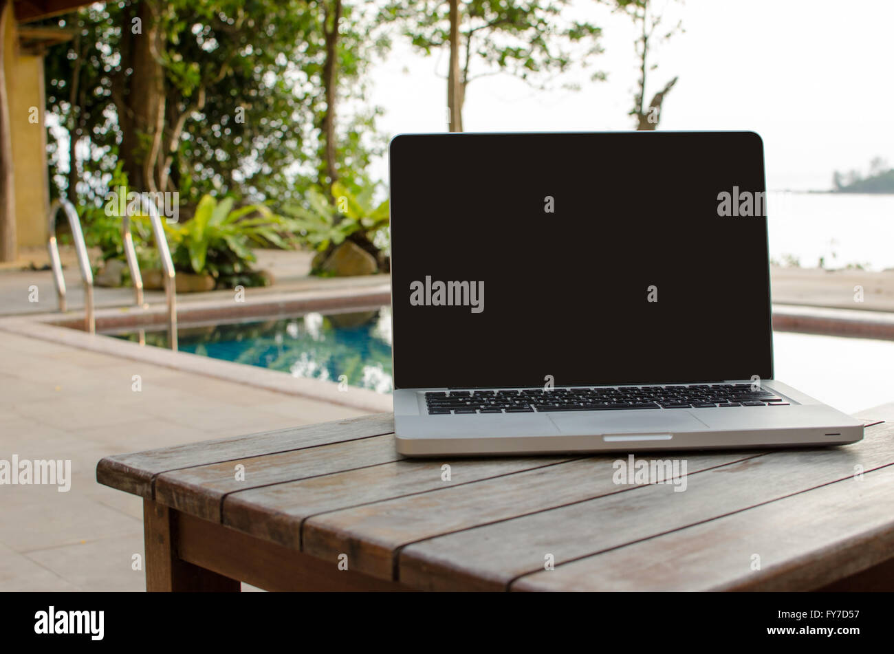 computer on table background as a pool Stock Photo - Alamy
