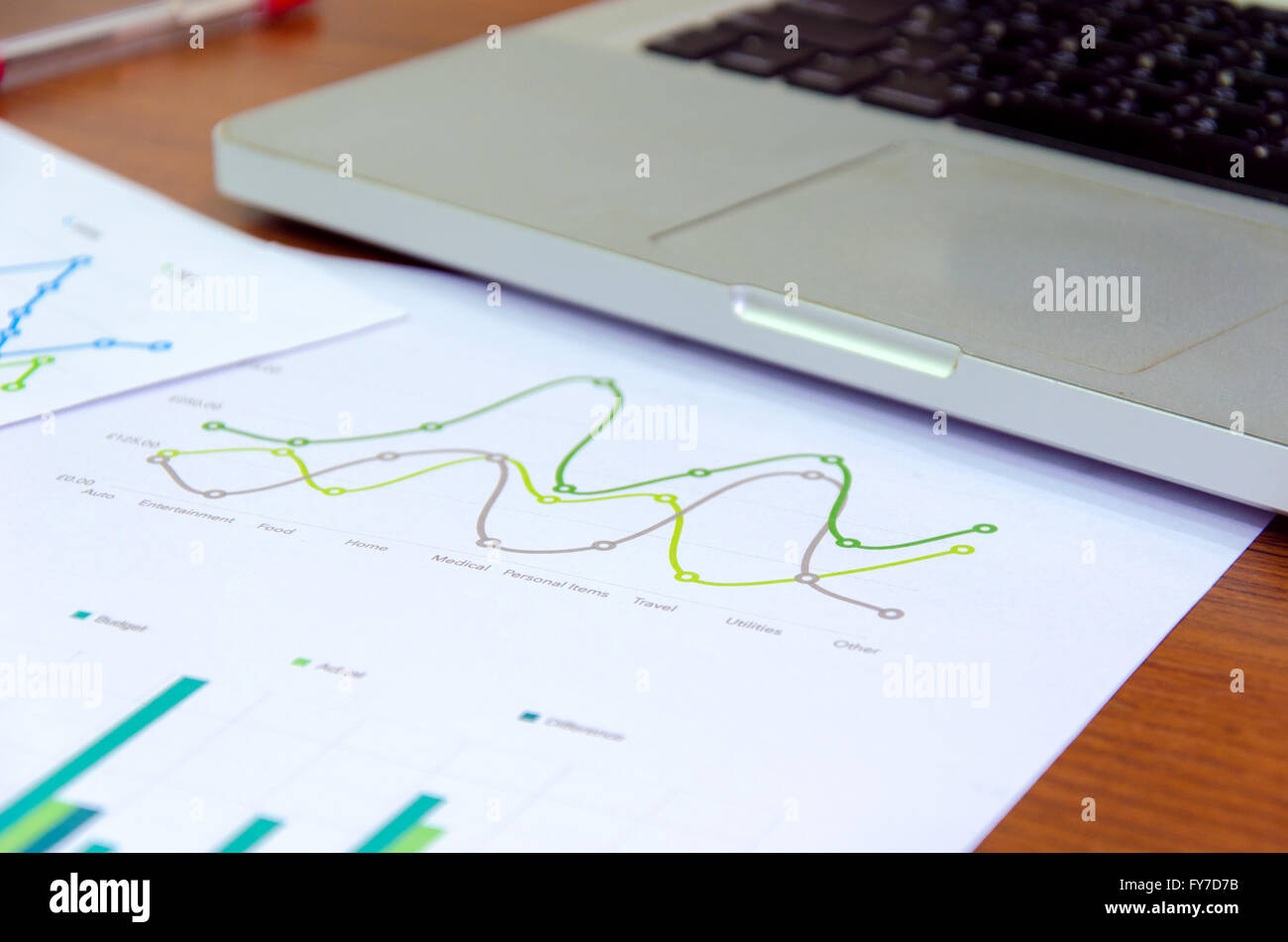 Business chart and computer Stock Photo - Alamy