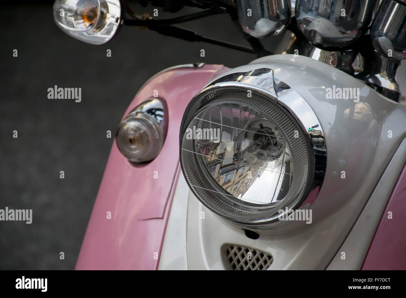 Headlight of a pink scooter Stock Photo - Alamy