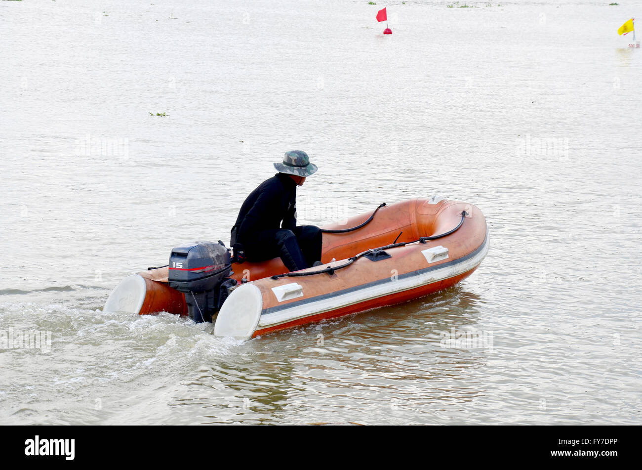 Security guard riding Inflatable Boat in Long boat Racing at Chaopraya ...