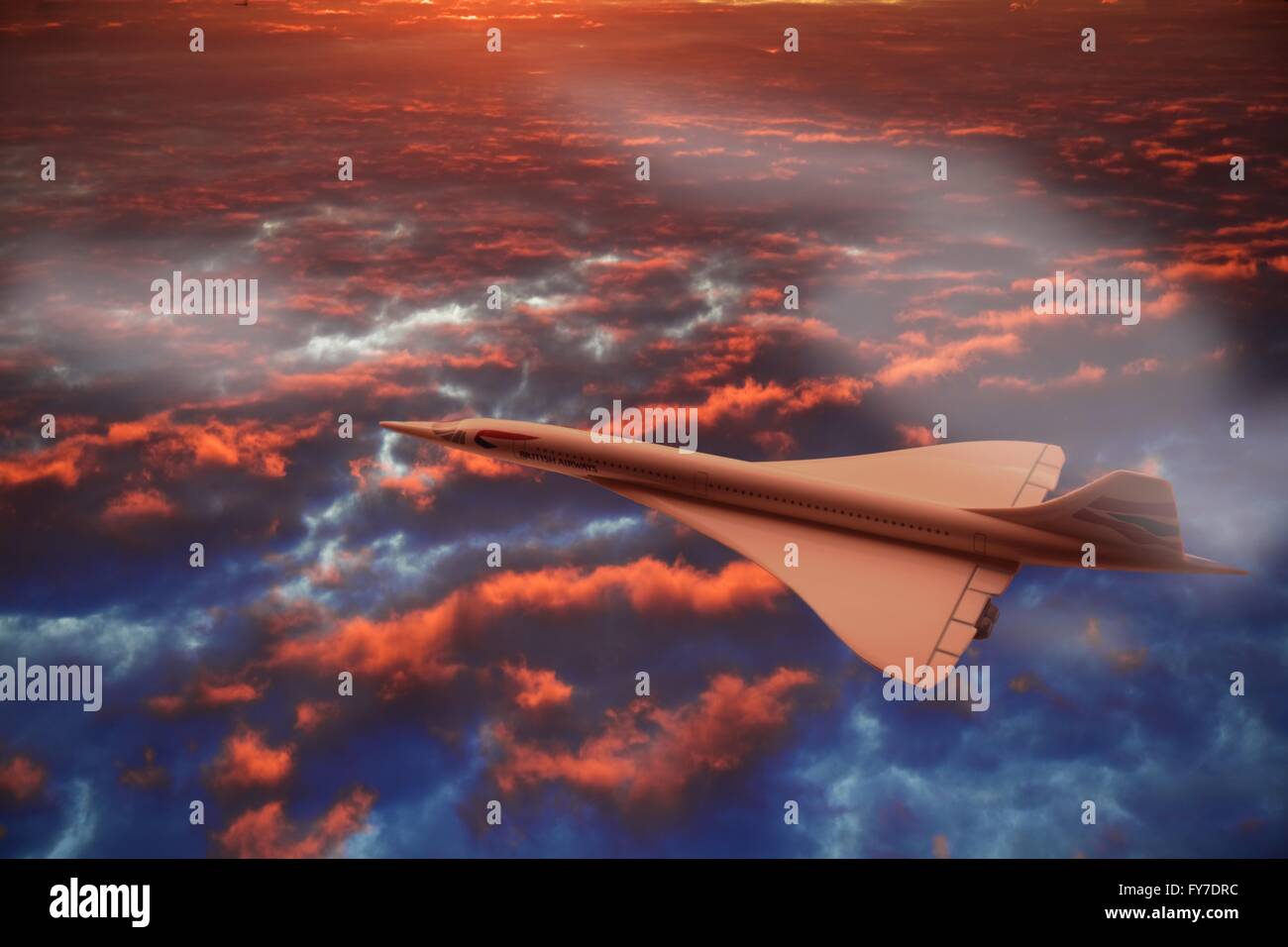 Concorde model flying in a sunrise clouds Stock Photo - Alamy