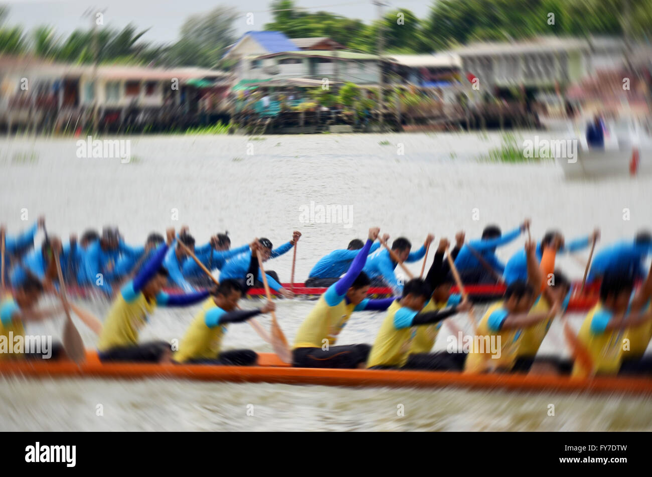 Blurred of motion of thai people rowing long boat in long boat racing ...