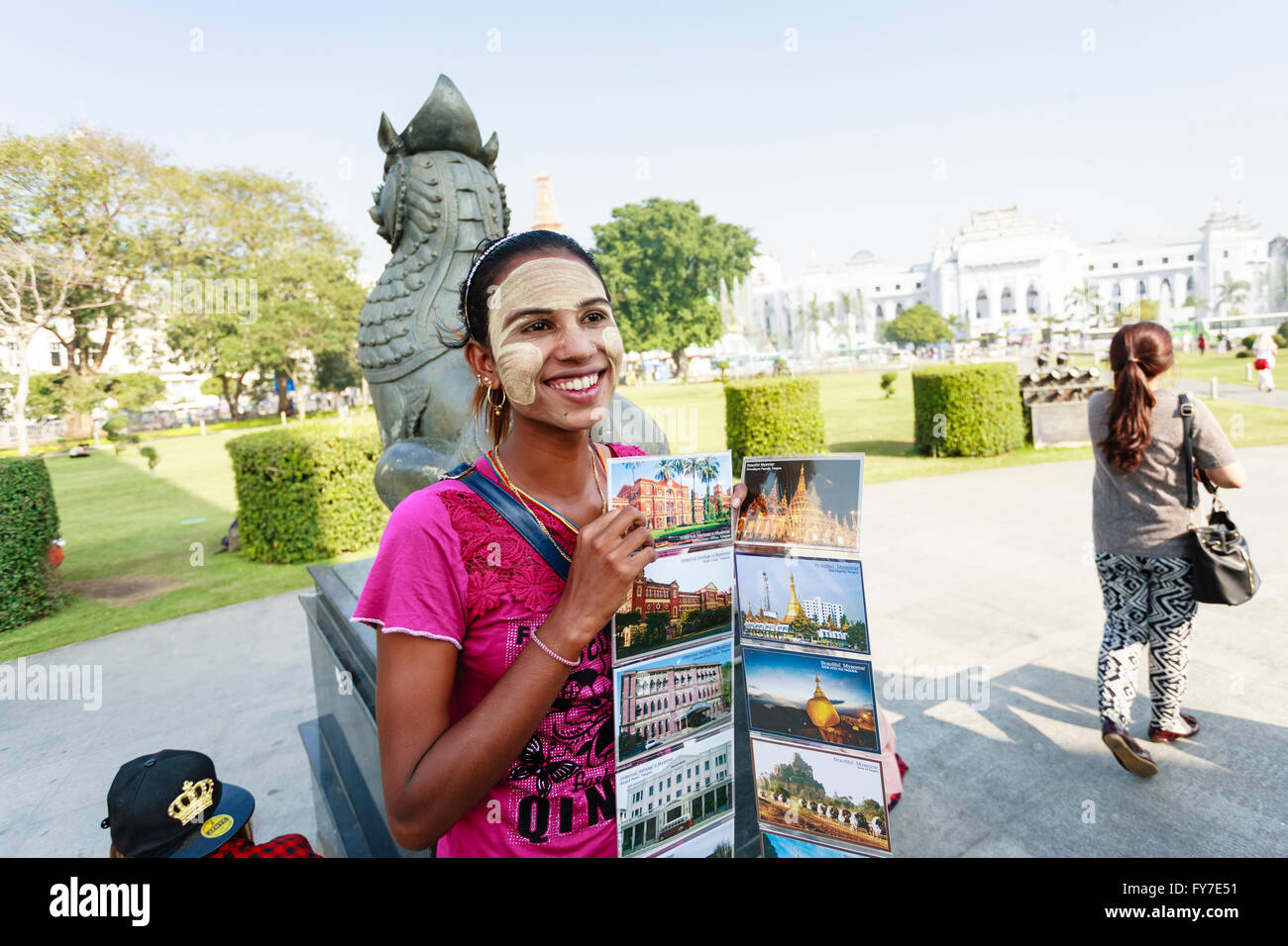 An ethnic minority woman sell postcard in a center park in Yangon, Myanmar Stock Photo - Alamy