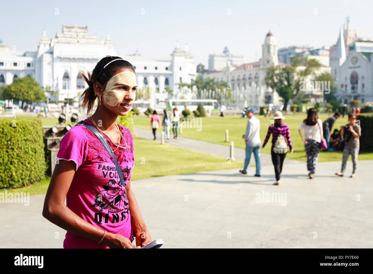 An ethnic minority woman sell postcard in a center park in Yangon, Myanmar Stock Photo - Alamy