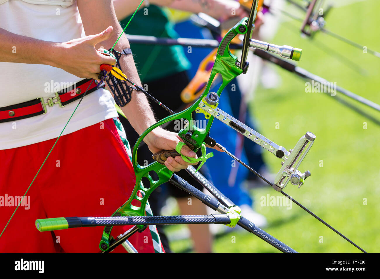 People are shooting with recurve bows during an archery competition ...