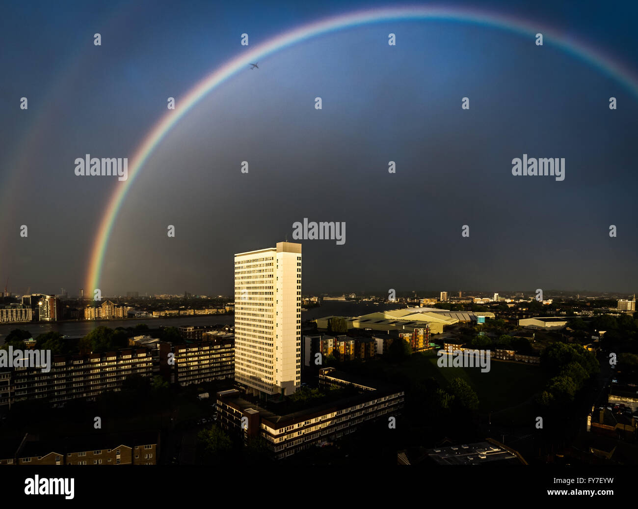UK Weather: A colourful rainbow breaks over a south east London housing ...