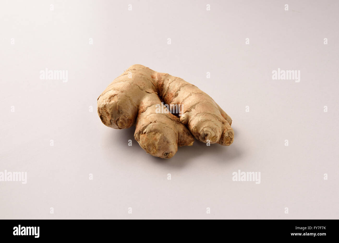 Fresh single ginger Stock Photo - Alamy