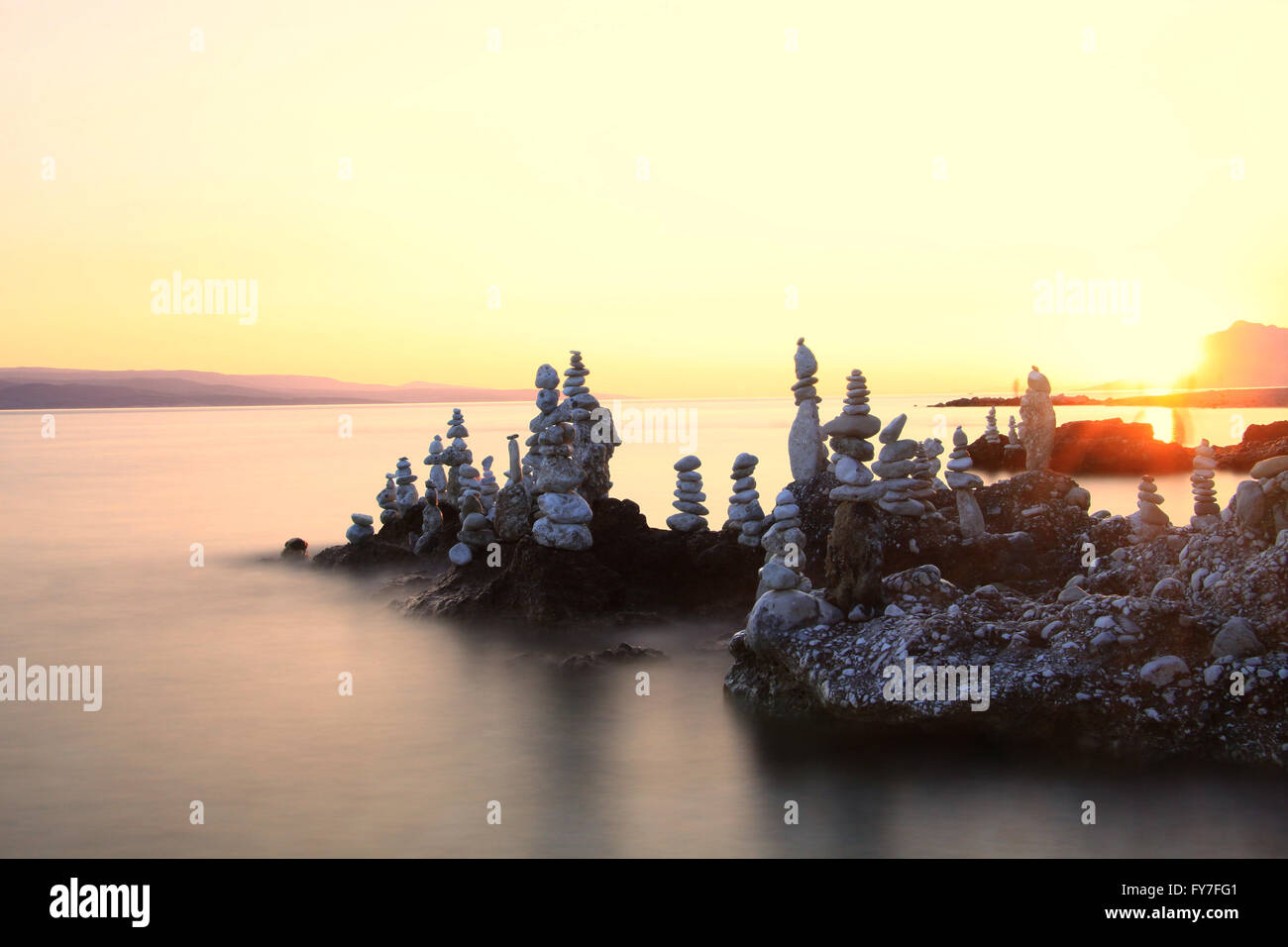 Beach sunset rock formation romantic hi-res stock photography and ...