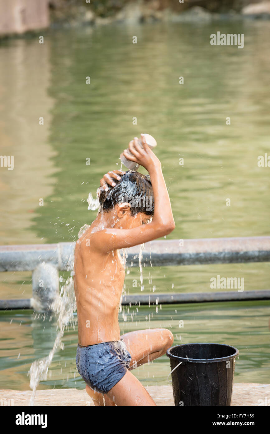 Boy bathing in holy water of Galta, Jaipur Stock Photo - Alamy