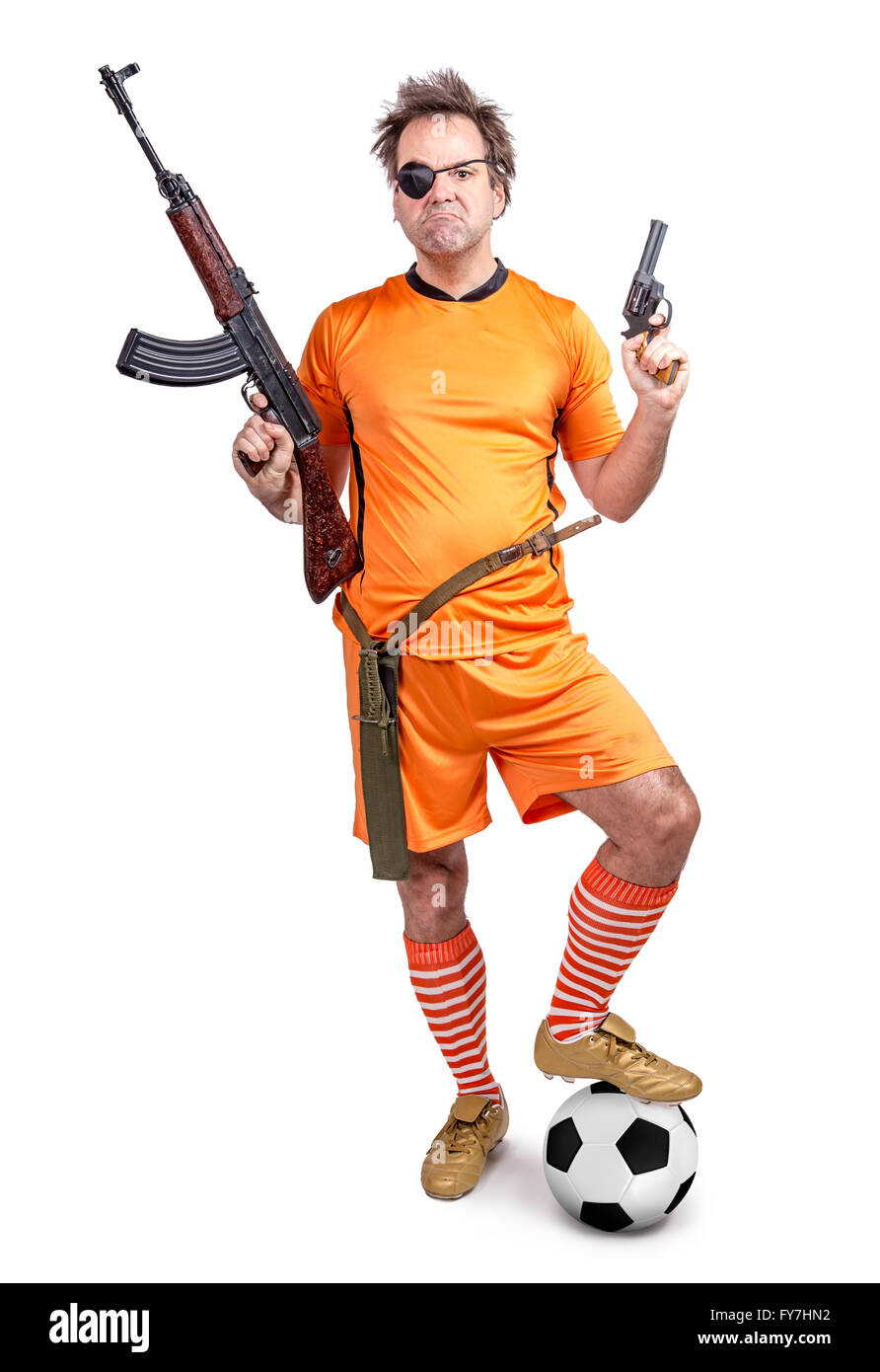 armed soccer player with the ball stands on guard Stock Photo - Alamy