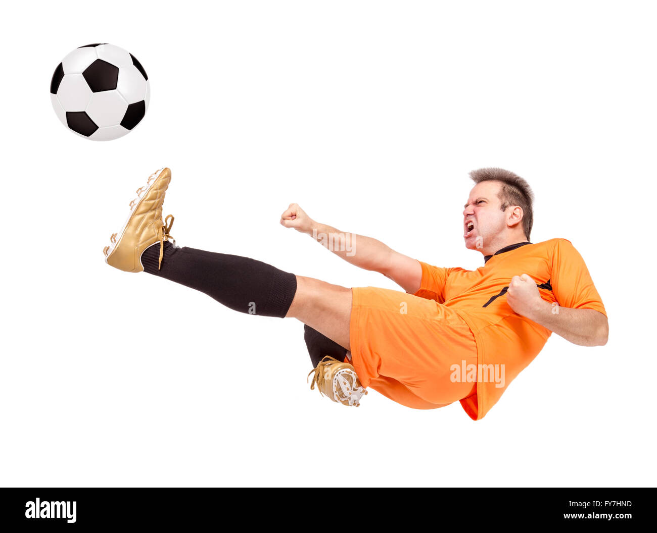 Soccer football player kicking the ball isolated on a white background ...