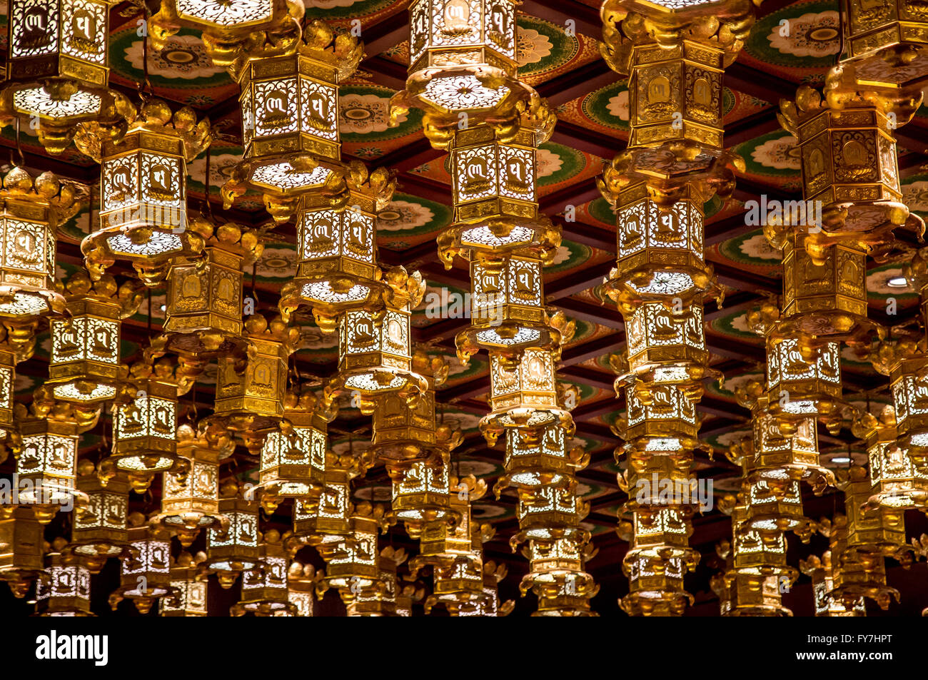 many decorative lamp hanging from the ceiling of the monastery, Buddha ...