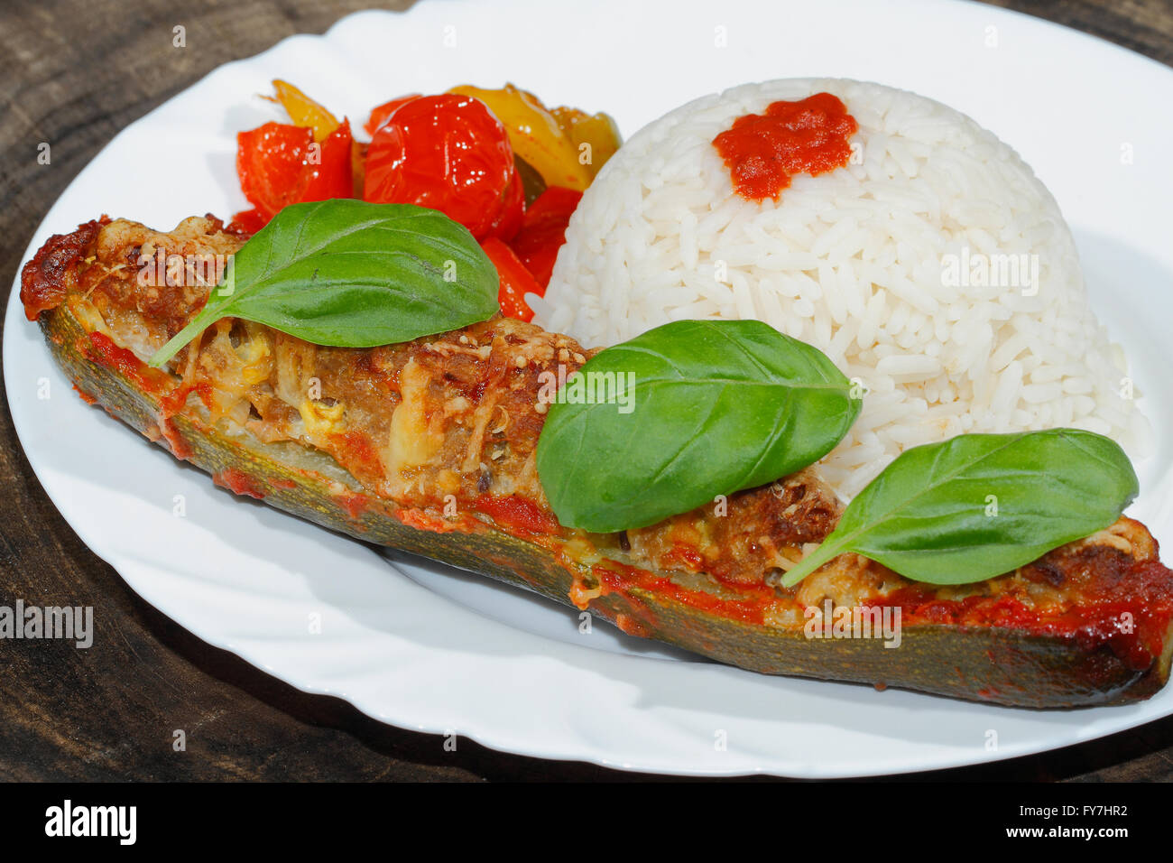 Stuffed zucchini, rice, stewed peppers and tomatoes, vegetables, side ...