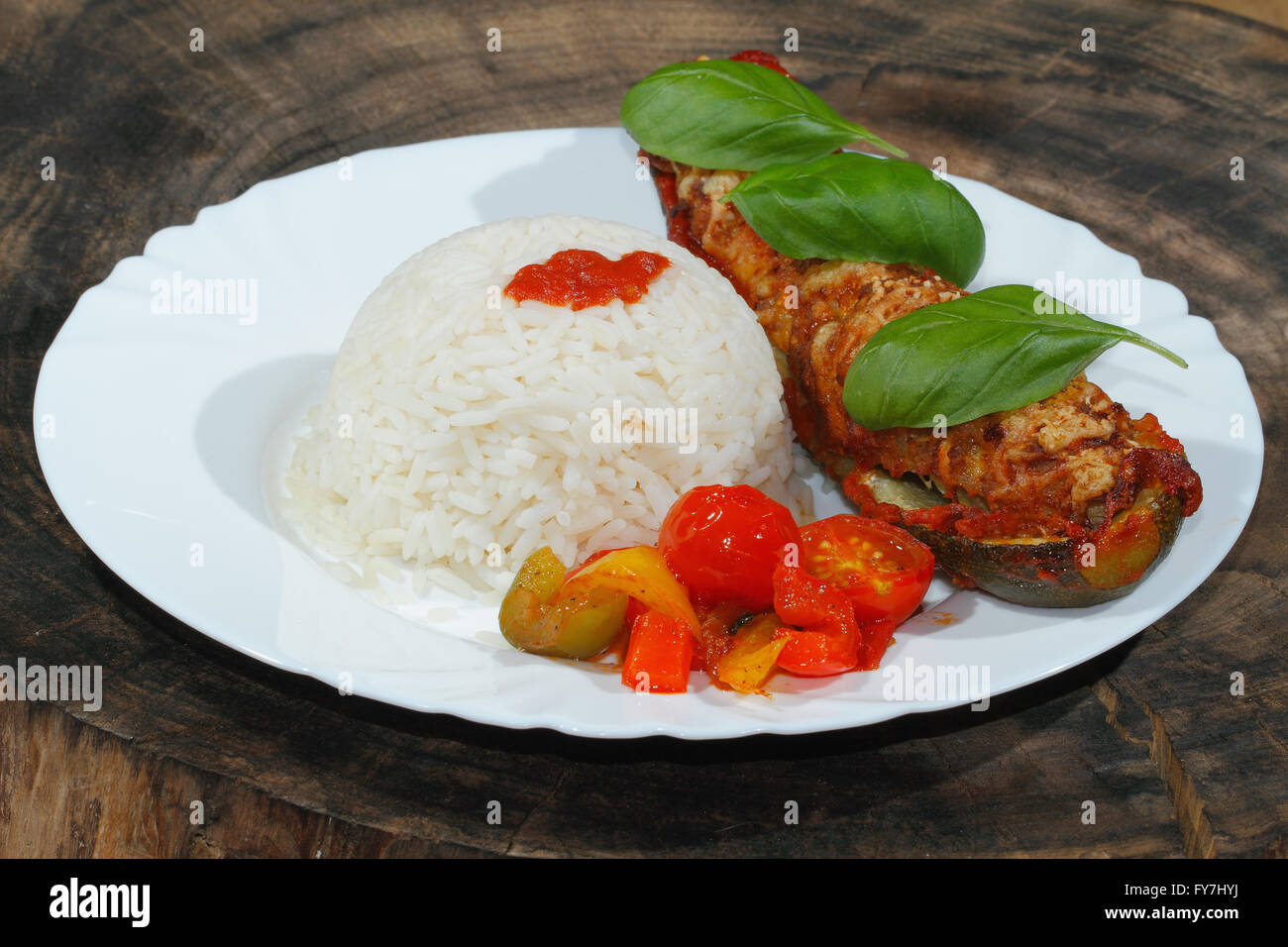 Stuffed zucchini, rice, stewed peppers and tomatoes, vegetables, side ...