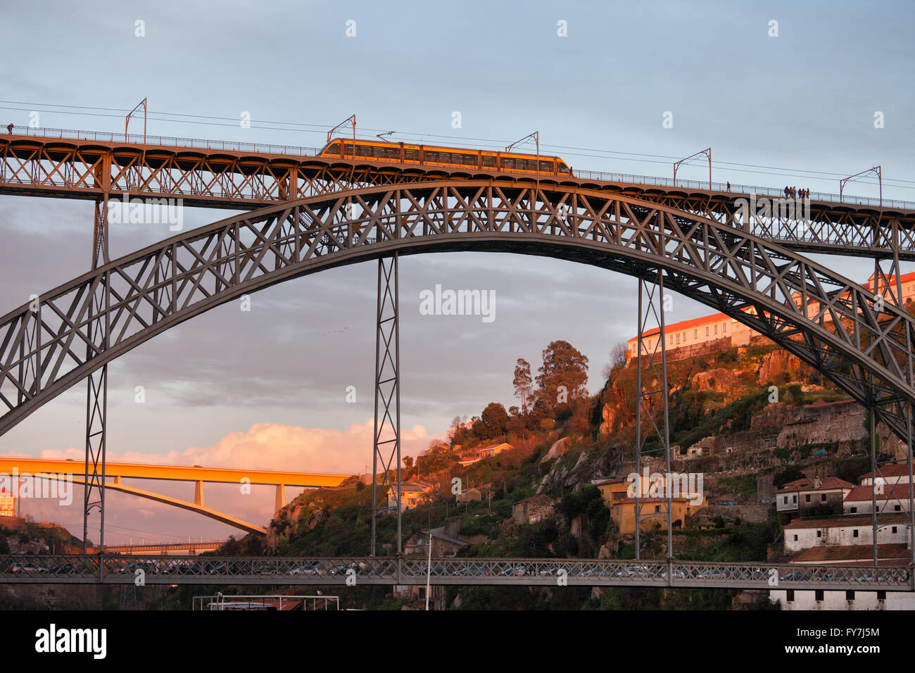 Dom Luis I Bridge with light rail metro line vehicle between Porto and ...